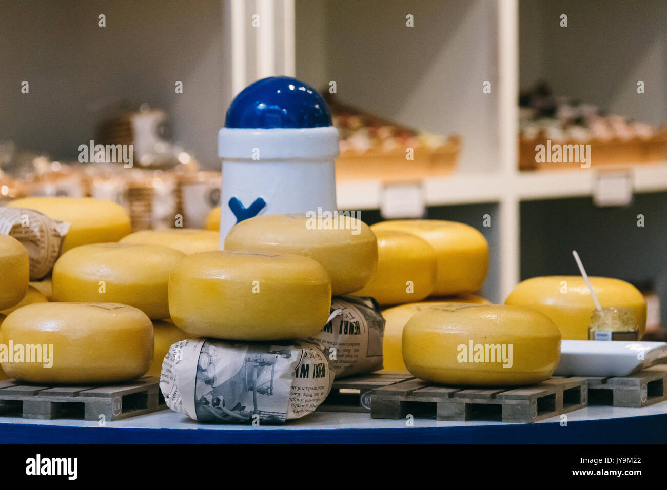 Cheese factory production shelves with aging cheese Stock Photo - Alamy