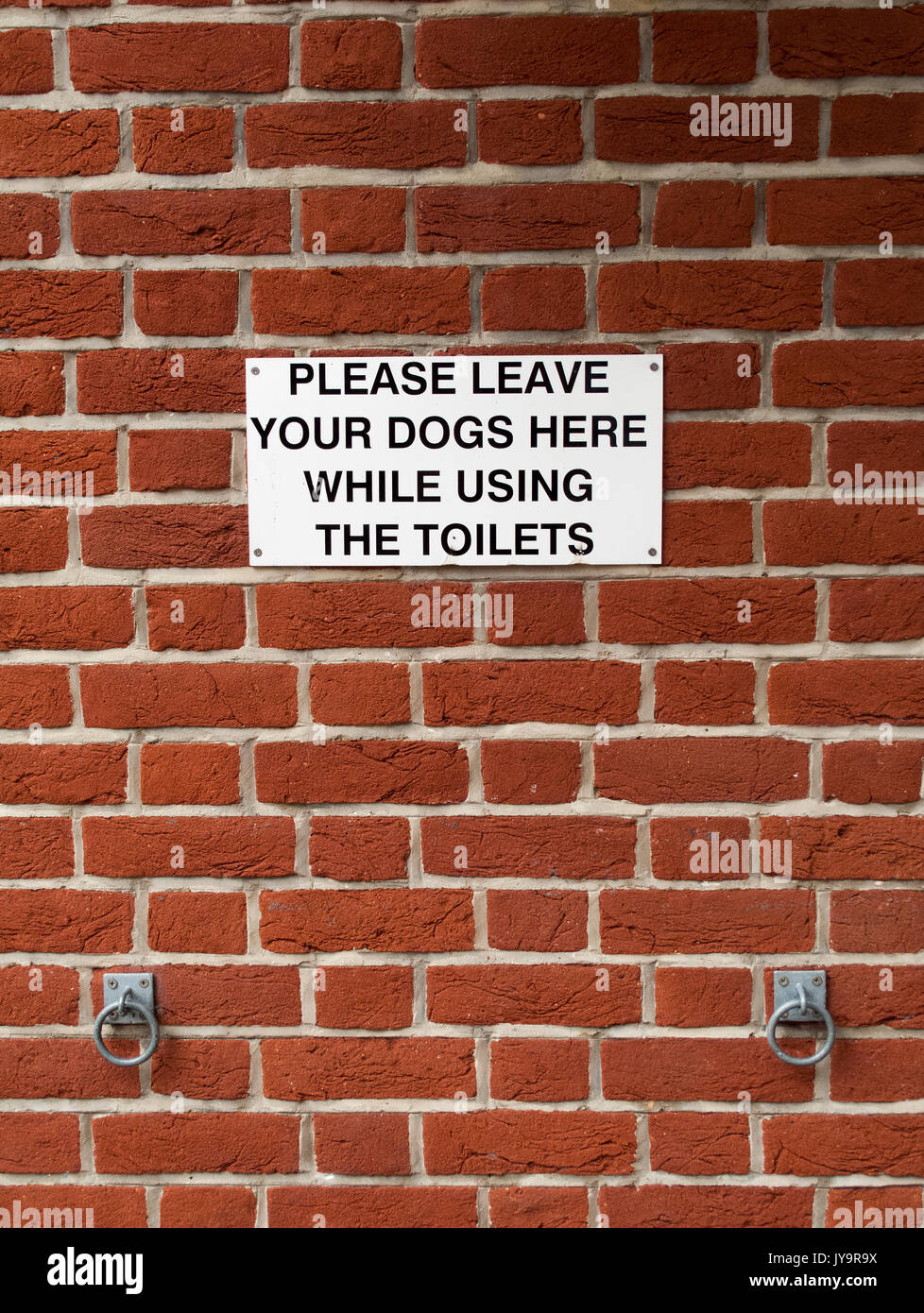 Comical please leave your dogs here while using the toilets sign ...