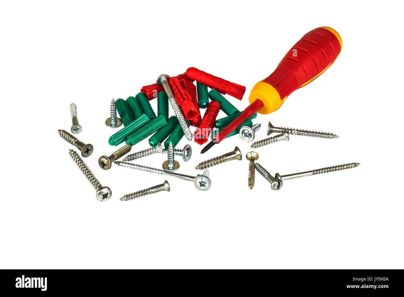 Screwdriver, screws and plastic dowels on a light background Stock ...