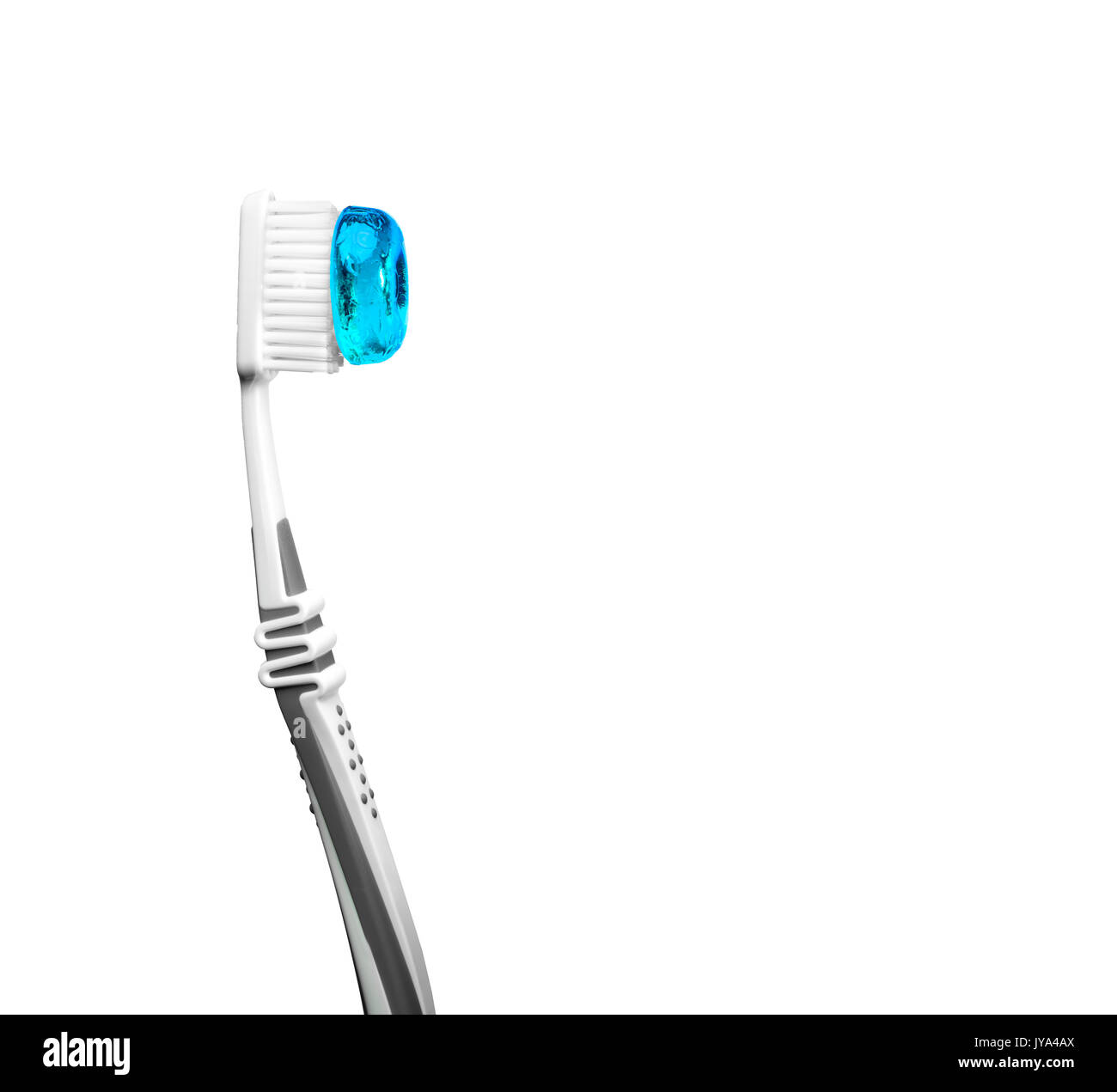 isolated toothbrush with blue bonbon on it in front of white background ...