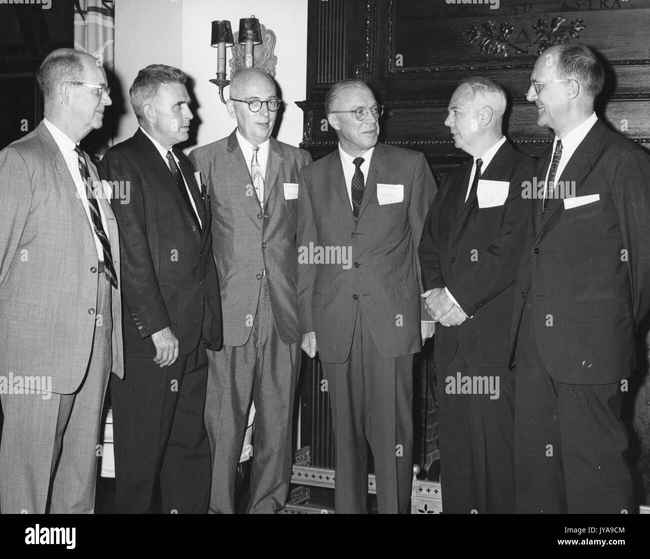 Men at dinner at the Johns Hopkins Club including (from left to right ...