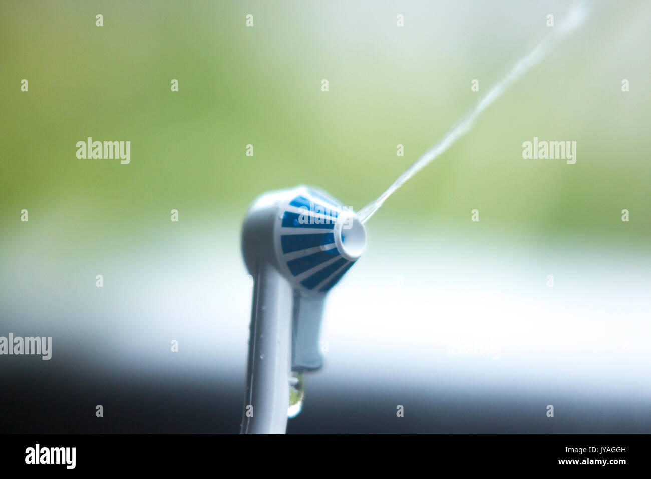 Dental water spray cleaner for interdental hygiene Stock Photo - Alamy