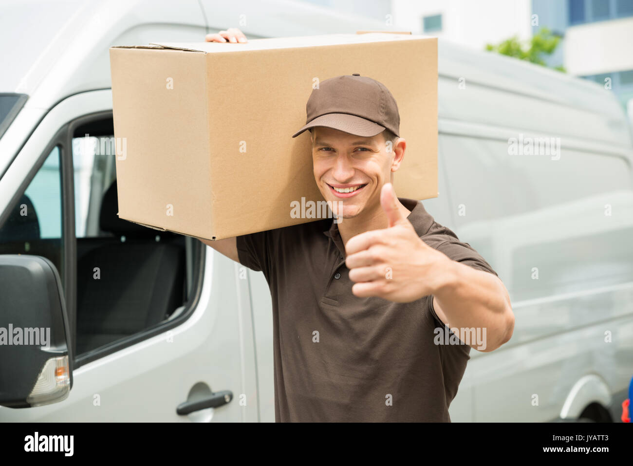 Happy Delivery Man Carrying Cardboard Boxes Showing Thumbs up Sign ...