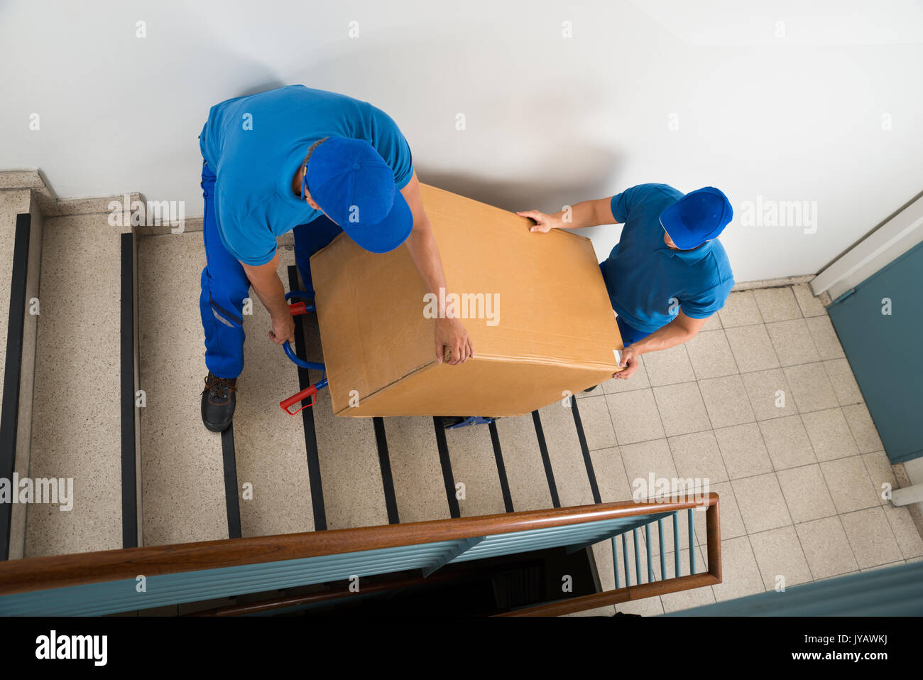 Man walking with box hi-res stock photography and images - Alamy
