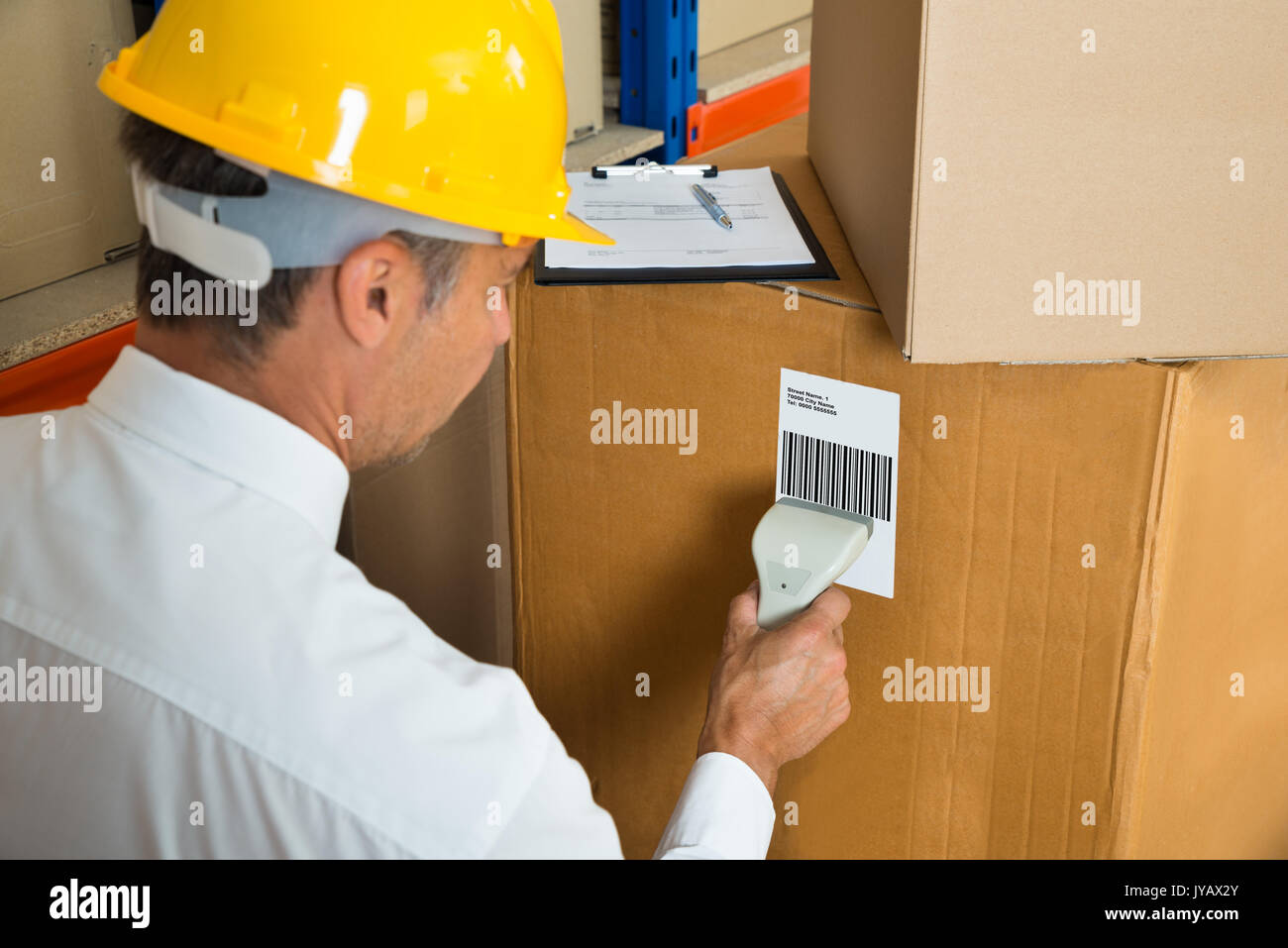 Manager Scanning Label On Cardboard Box With Barcode Scanner In ...