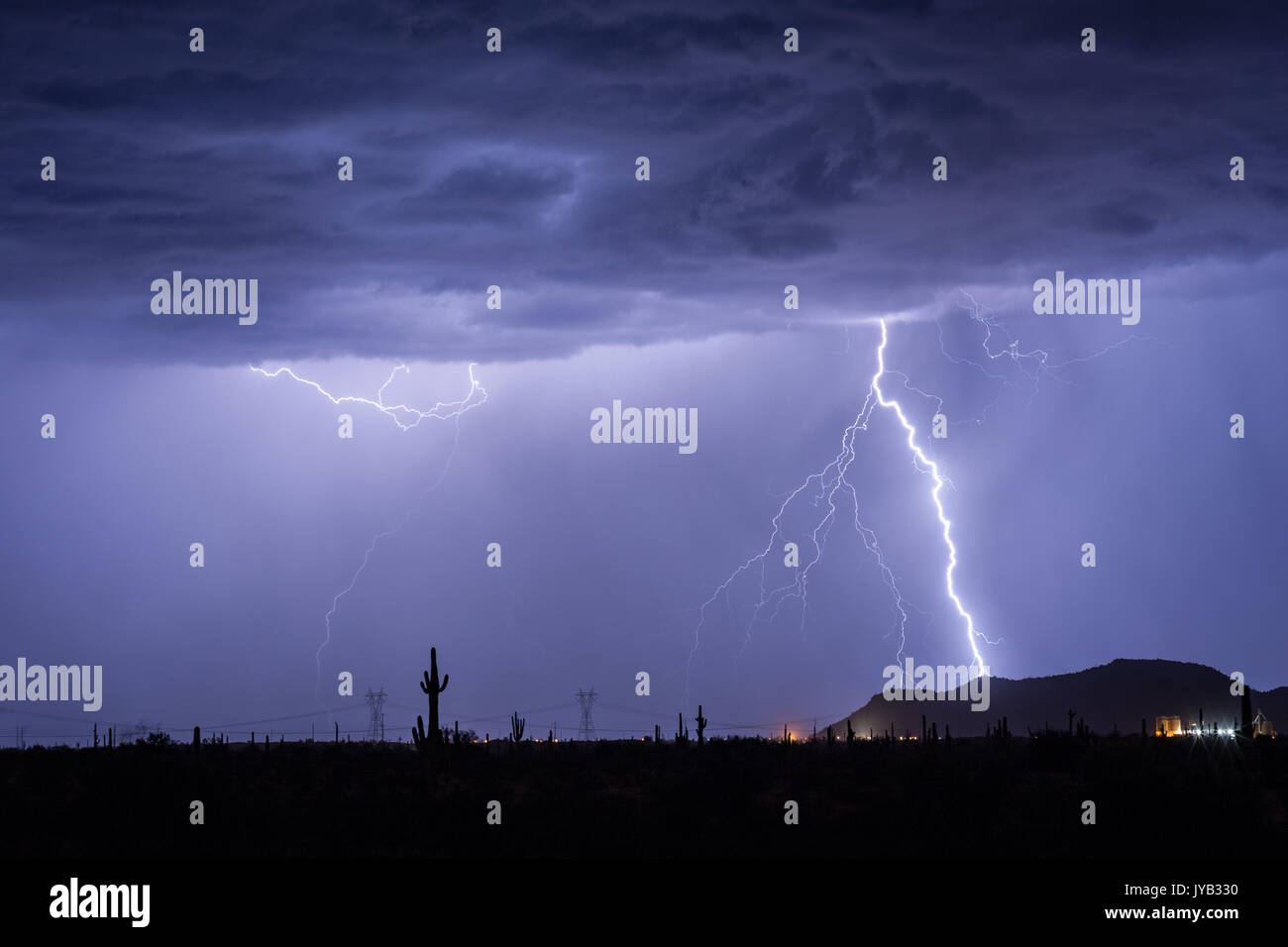 Lightning striking a mountain during a storm in the Arizona desert ...