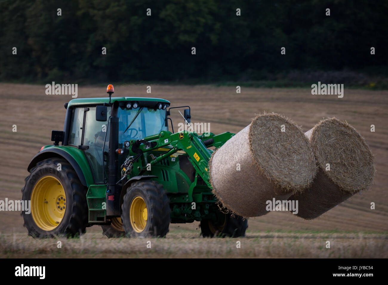 Tractor with round straw bales, Hertfordshire, England Stock Photo - Alamy