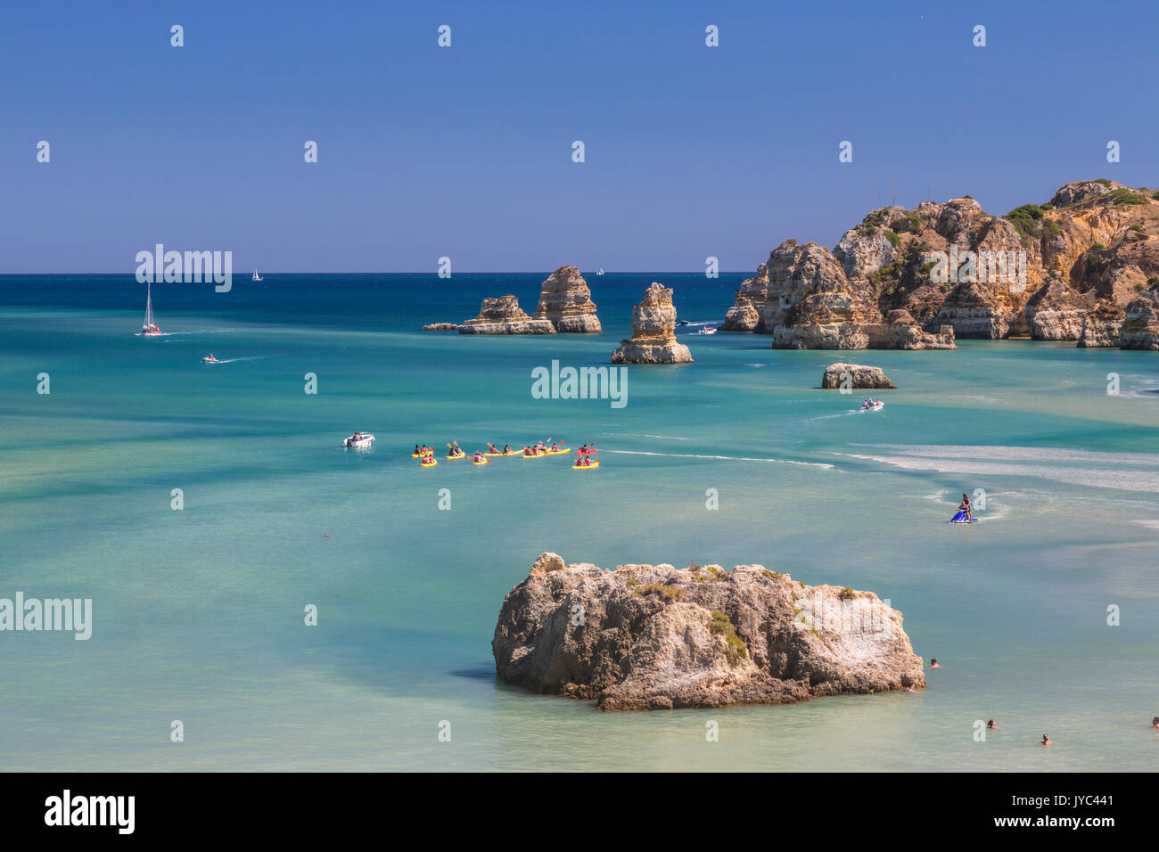 Canoes in the turquoise water of the Atlantic Ocean surrounding Praia ...
