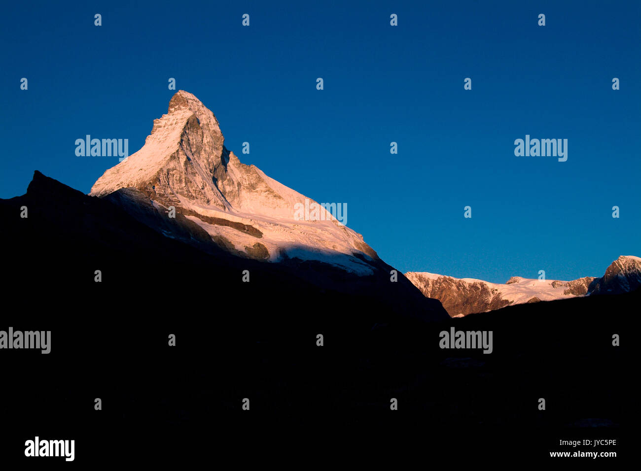 The wonderful pyramid of the snow-capped summit of the Matterhorn at ...
