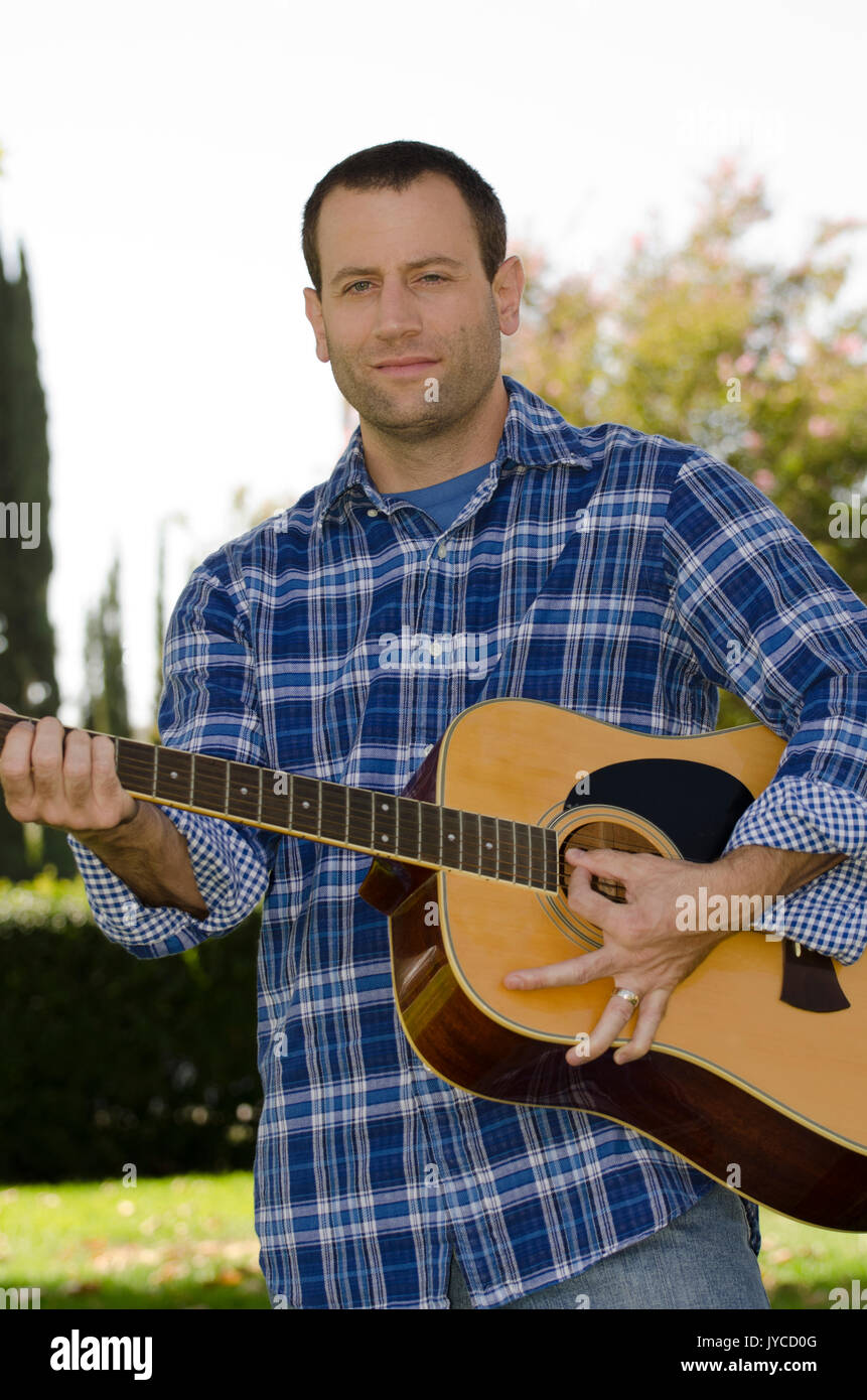 Playing the guitar outdoors hi-res stock photography and images - Alamy
