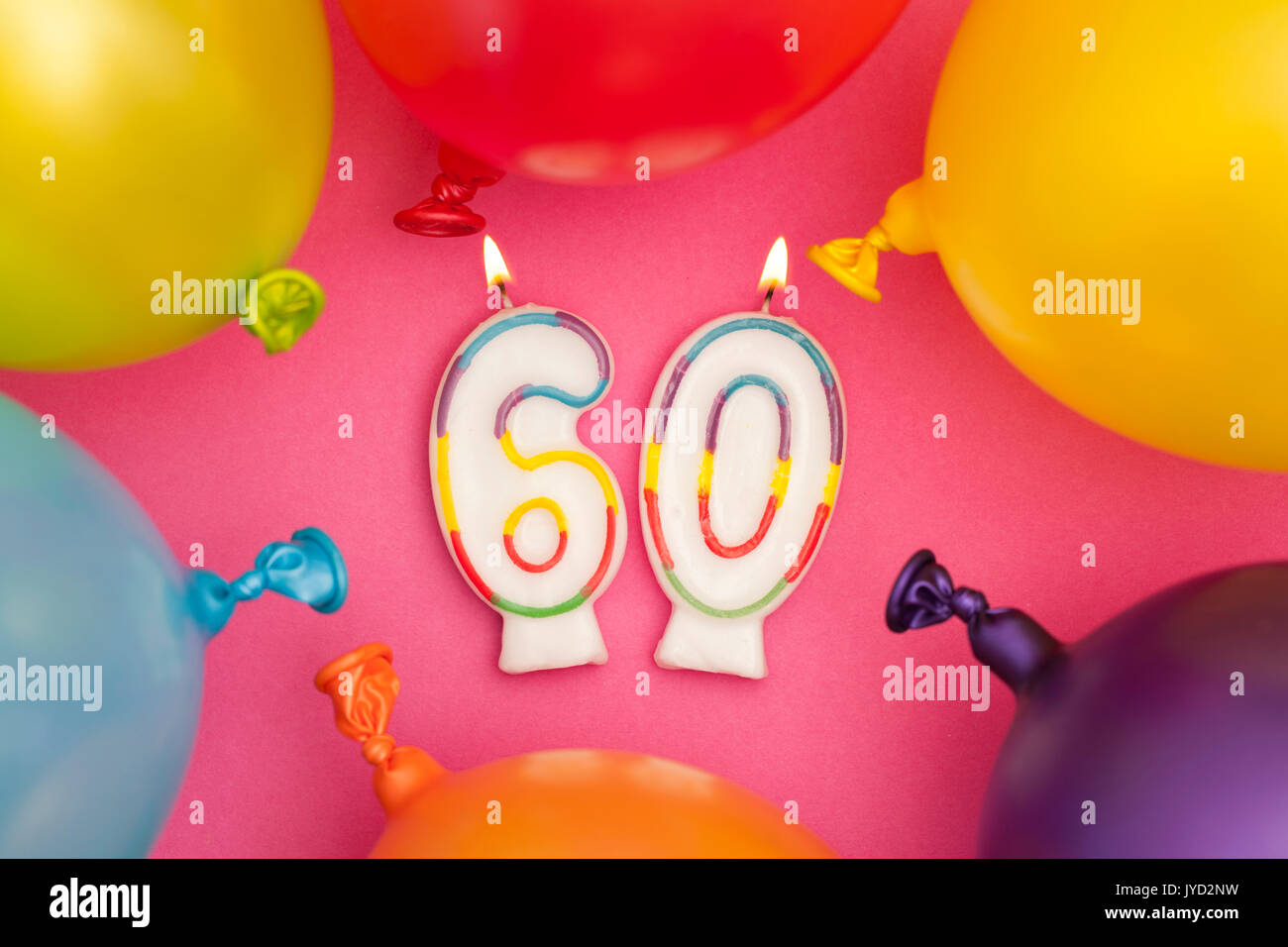 Happy Birthday number 60 celebration candle with colorful balloons ...