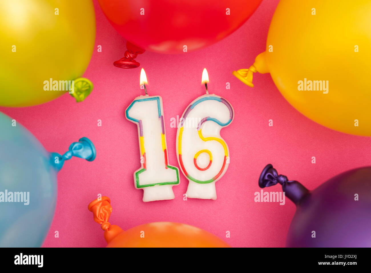 Happy Birthday number 16 celebration candle with colorful balloons ...