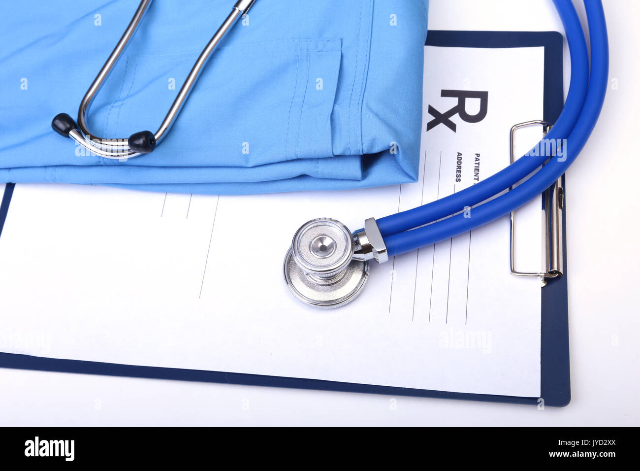 Medical stethoscope head lying on blue doctor uniform closeup. Medical ...
