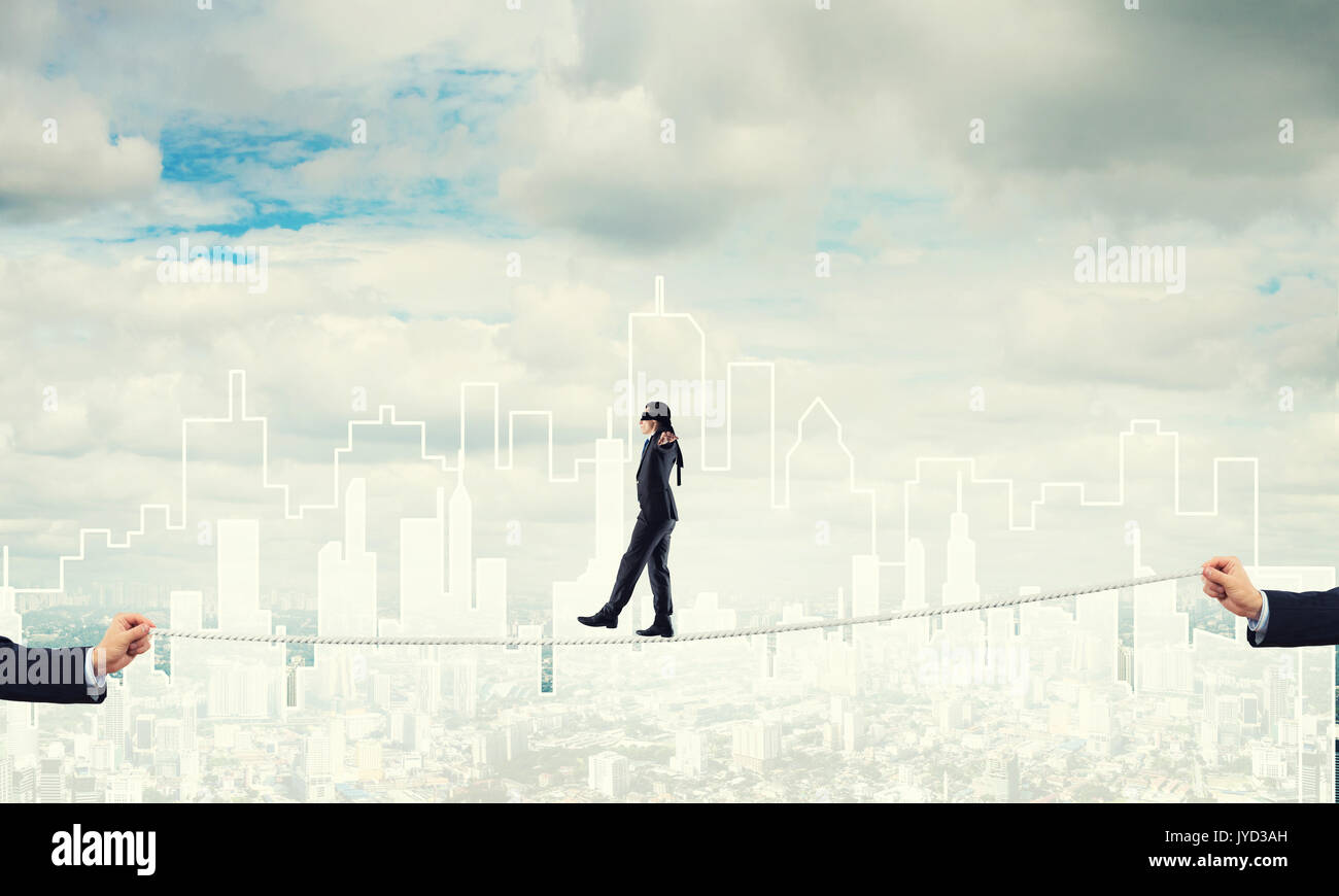 Business concept of risk support and assistance with man balancing on ...