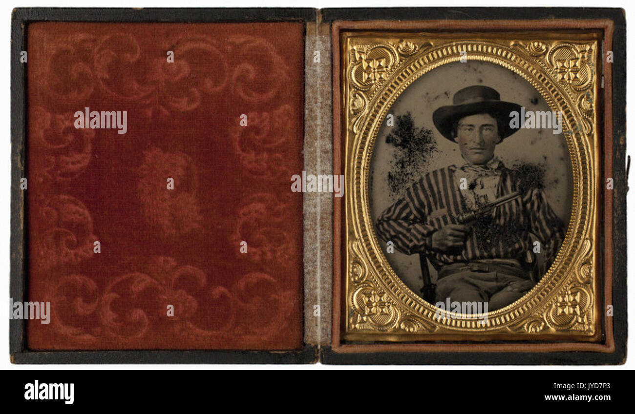 Private George T. Brown holding pistol, 3rd Texas Cavalry Regiment ...