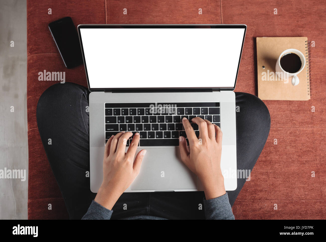 top view person using laptop computer on sofa inside home Stock Photo ...