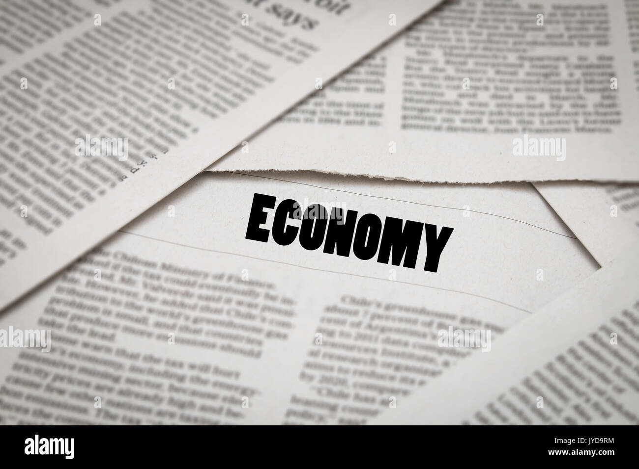 economy headline on newspaper background Stock Photo - Alamy