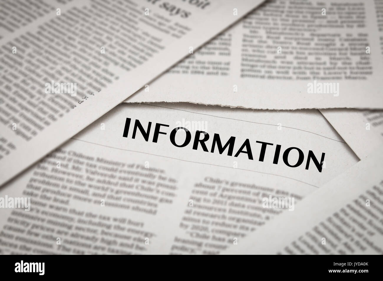 information headline on newspaper background Stock Photo - Alamy