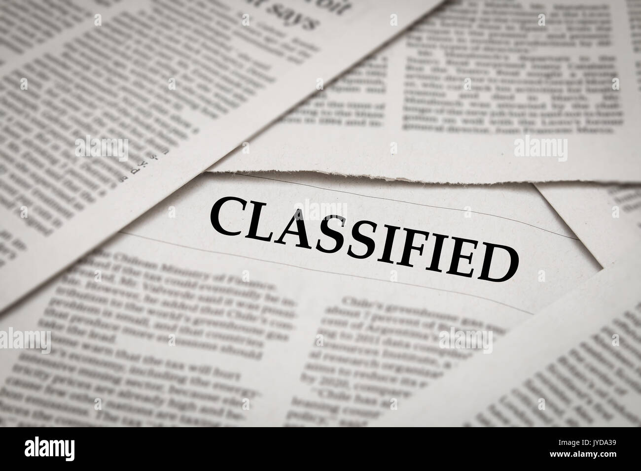 classified headline on newspaper background Stock Photo - Alamy