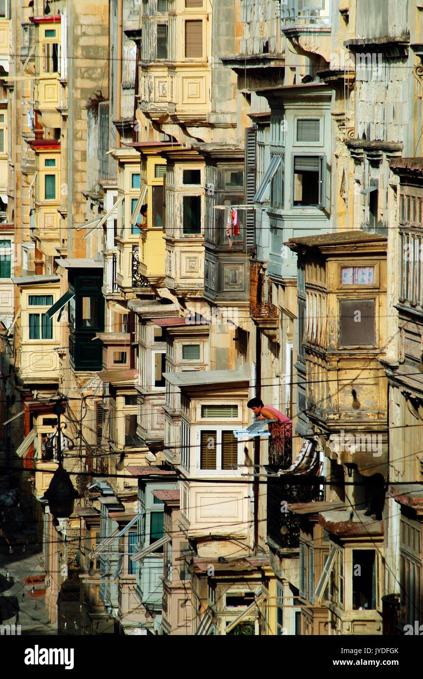 Malta's traditional honey-coloured stone buildings with their typical ...
