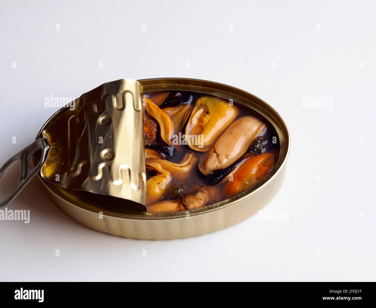 Natural mussels canned on white background Stock Photo - Alamy