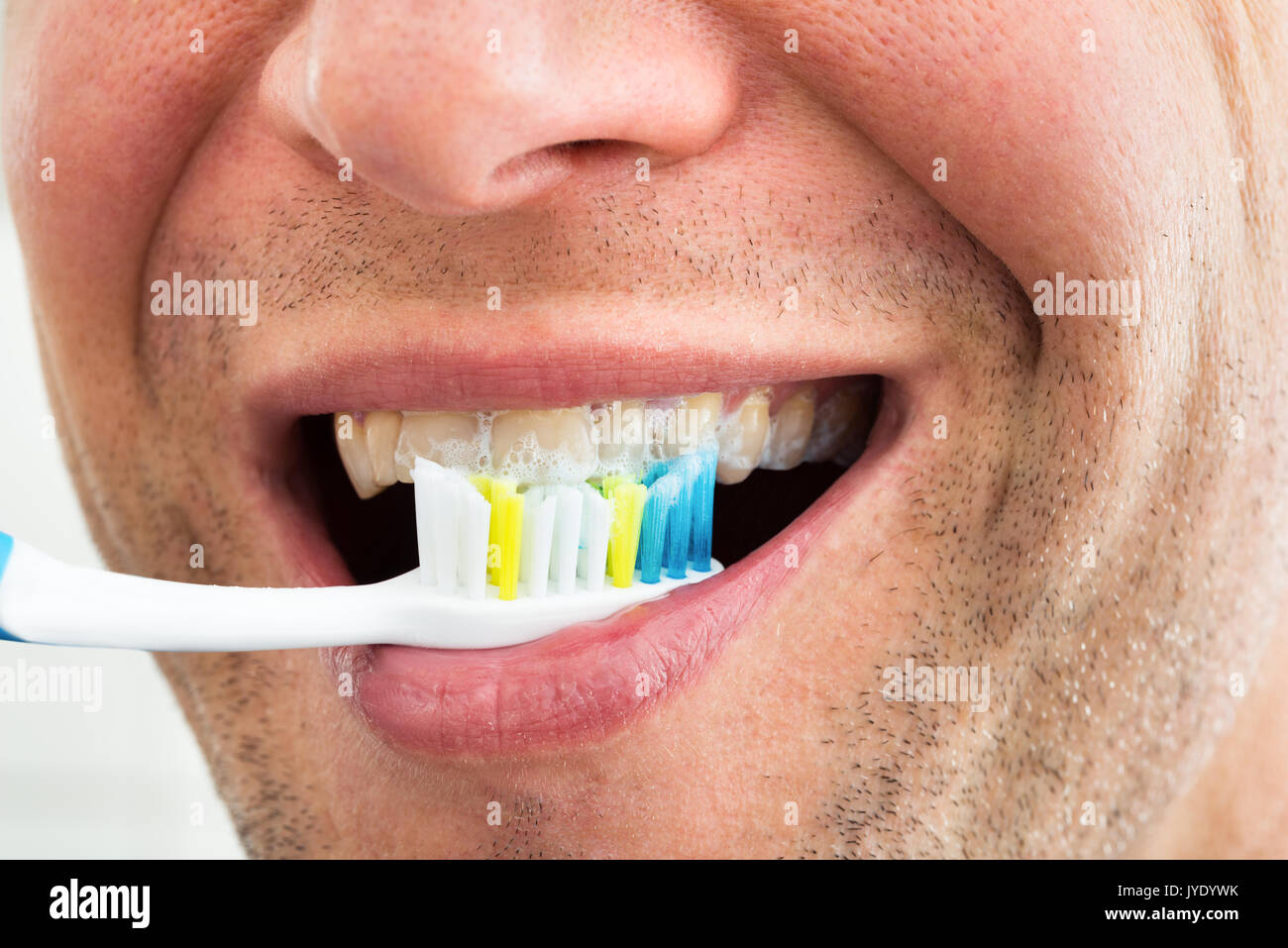 Close-up Of A Smiling Man With Toothbrush Stock Photo - Alamy