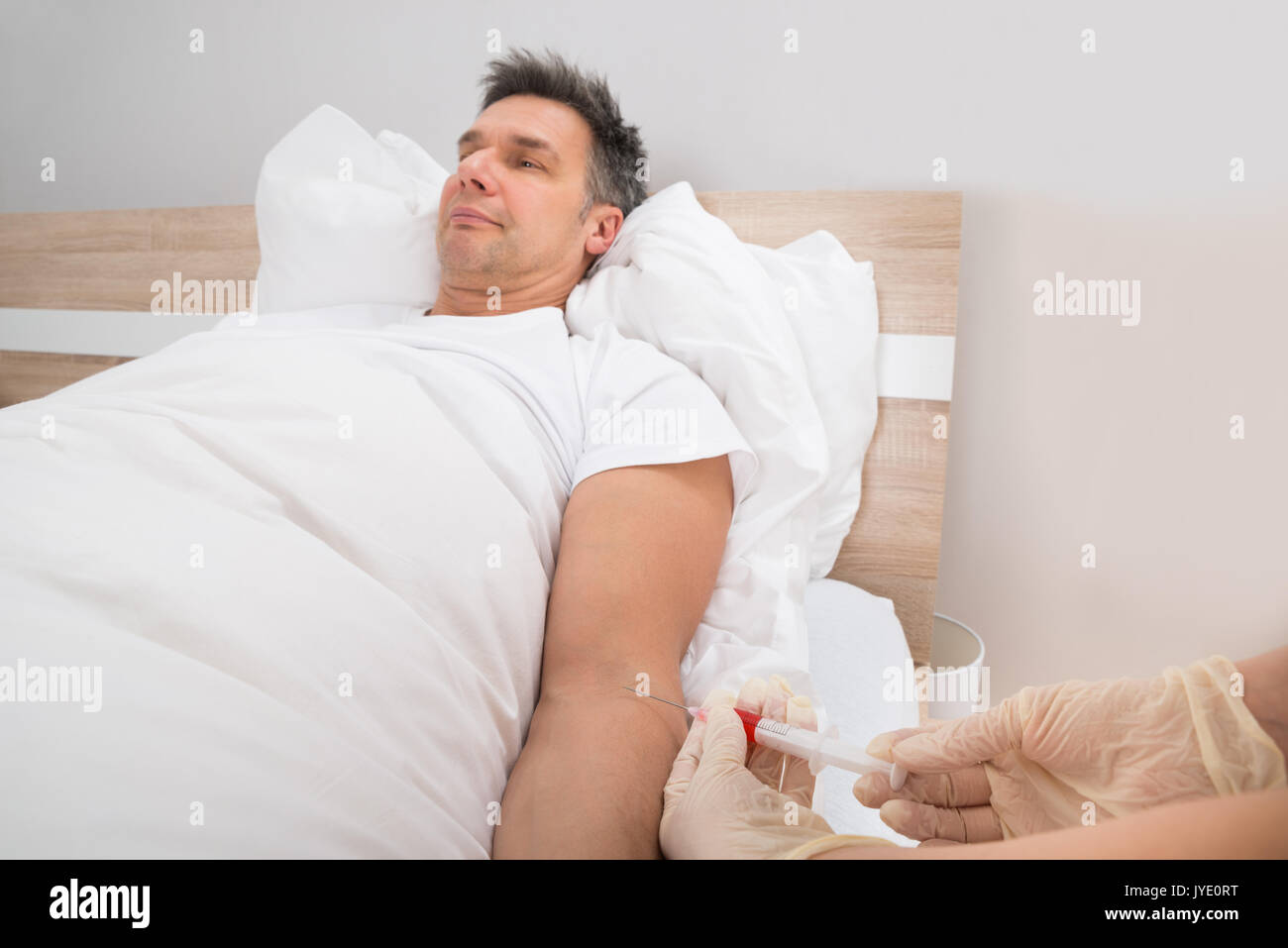 Doctor Taking Blood Samples Of Patient With The Help Of Injection Stock ...