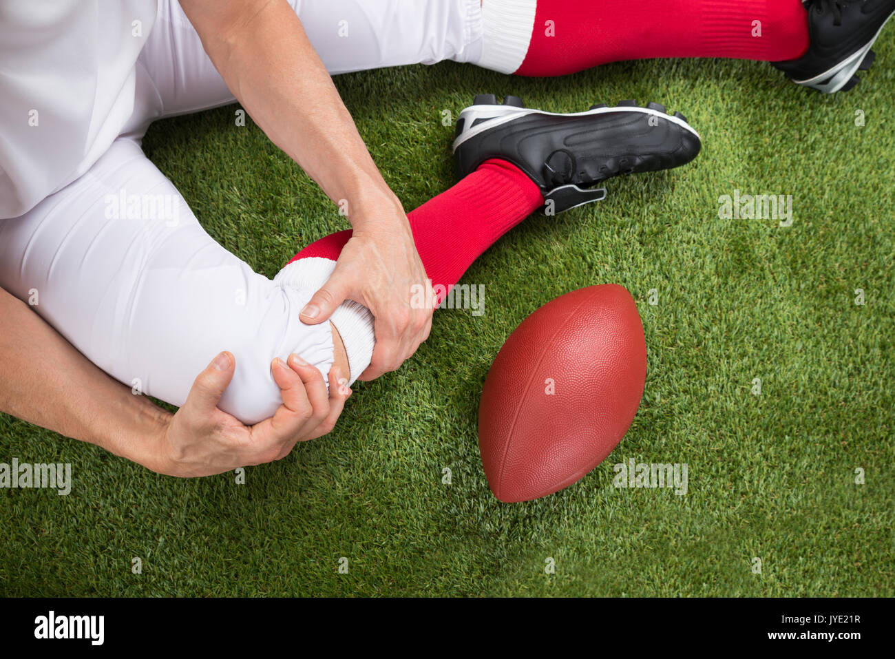 Close-up Of A American Football Player With Injury In Leg On Field ...