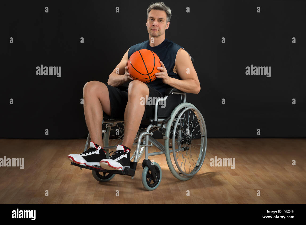 Portrait Of A Disabled Player On Wheelchair Holding Basketball Stock ...