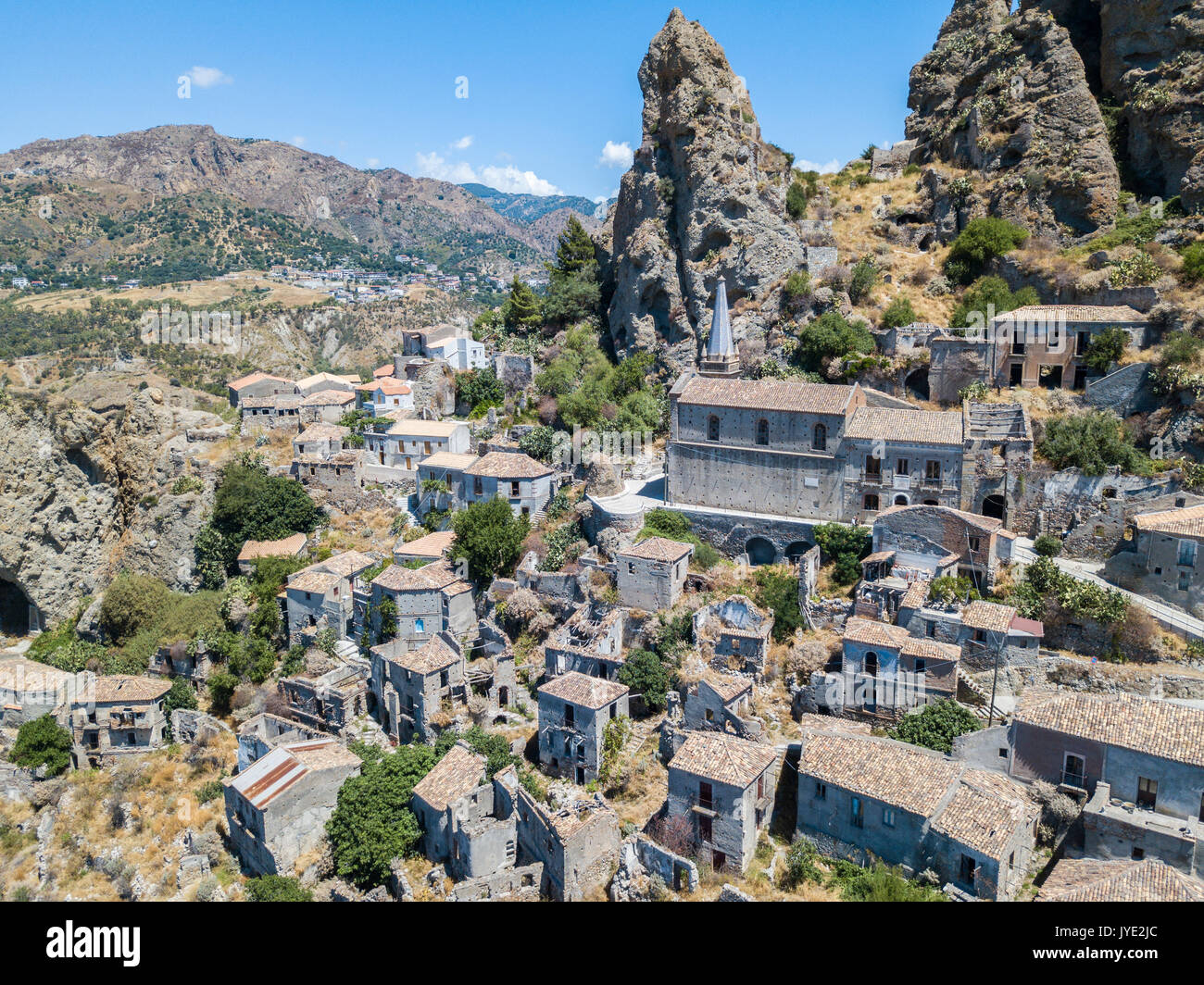 Aerial view of the Small village of Pentedattilo, church and ruins of ...