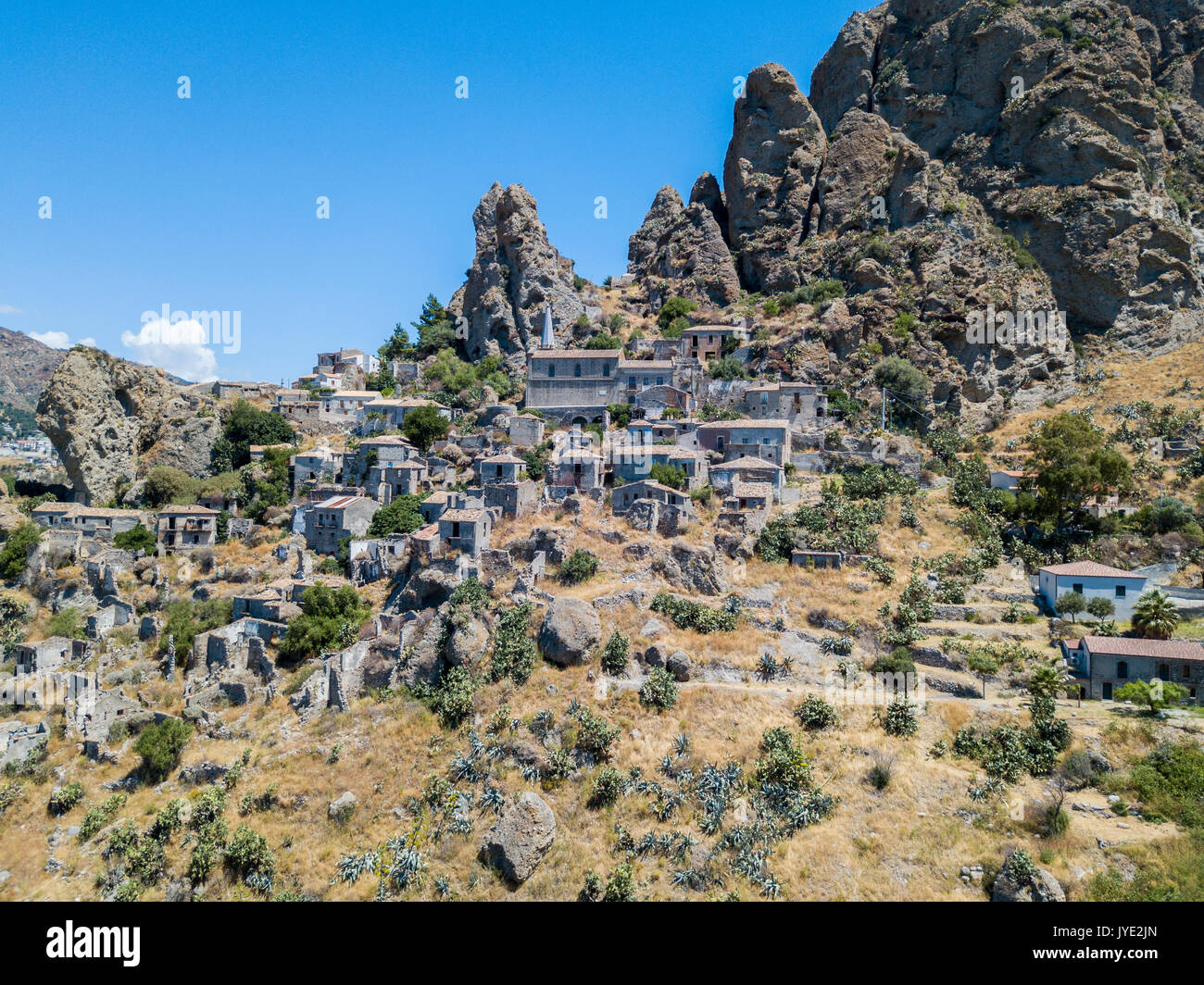 Aerial view of the Small village of Pentedattilo, church and ruins of ...
