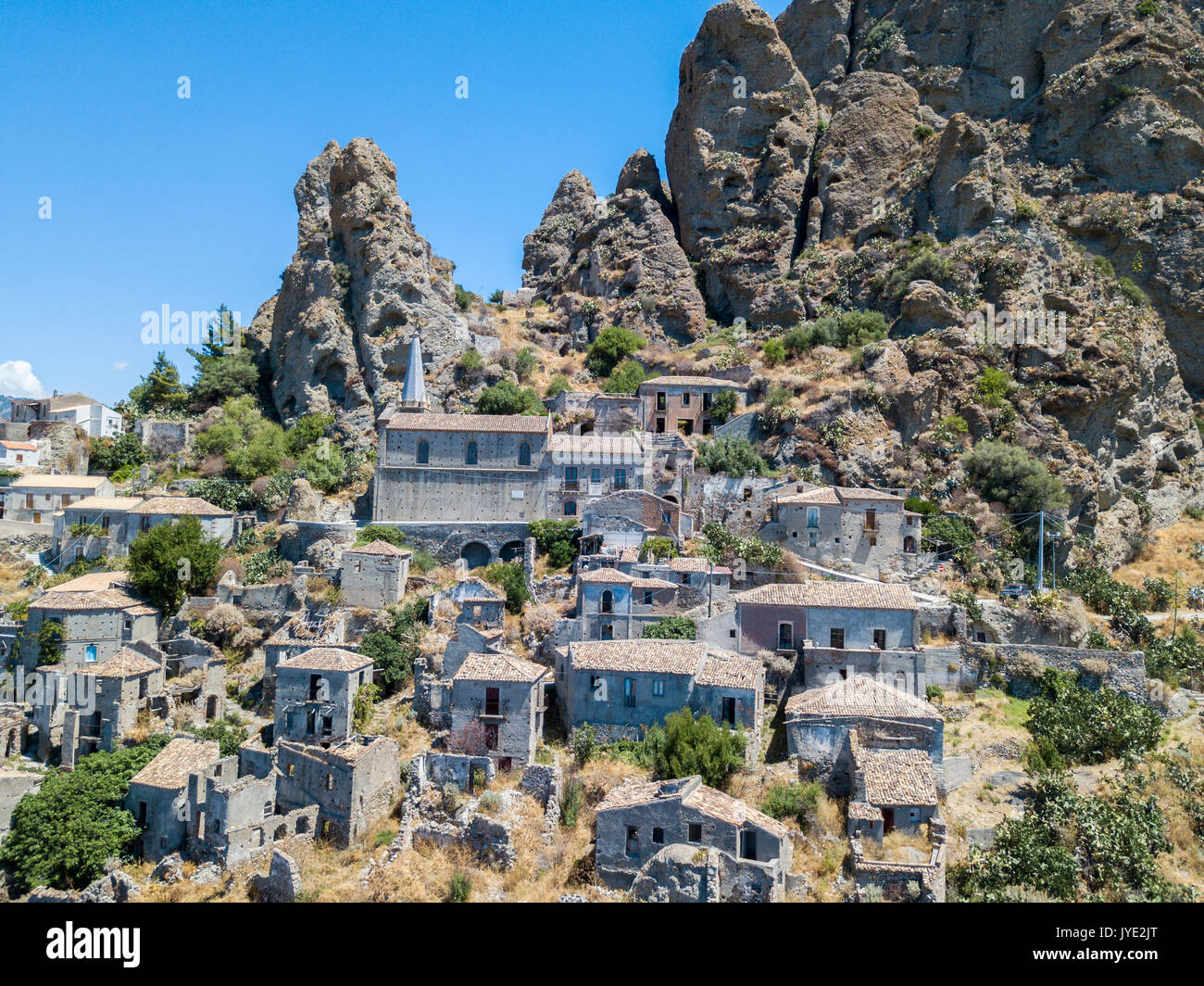 Aerial view of the Small village of Pentedattilo, church and ruins of ...