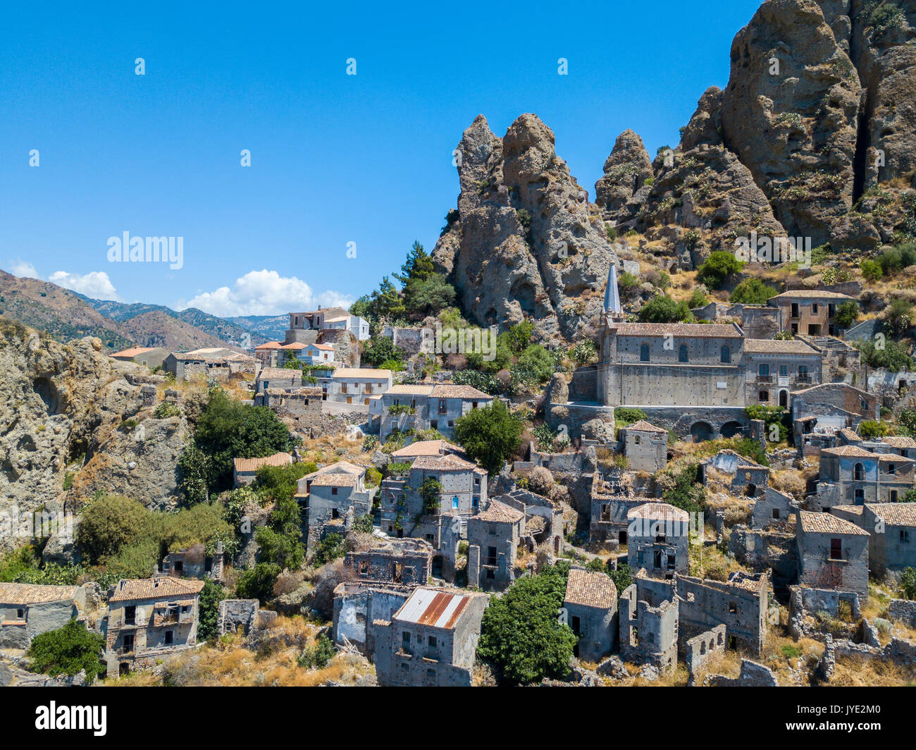 Aerial view of the Small village of Pentedattilo, church and ruins of ...