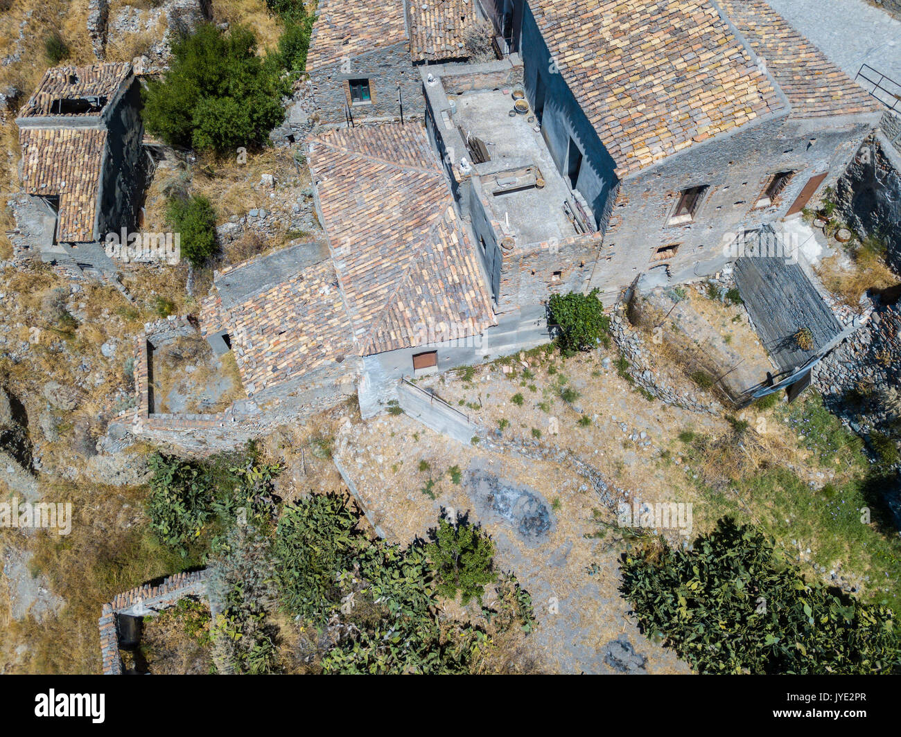 Aerial view of the Small village of Pentedattilo, church and ruins of ...