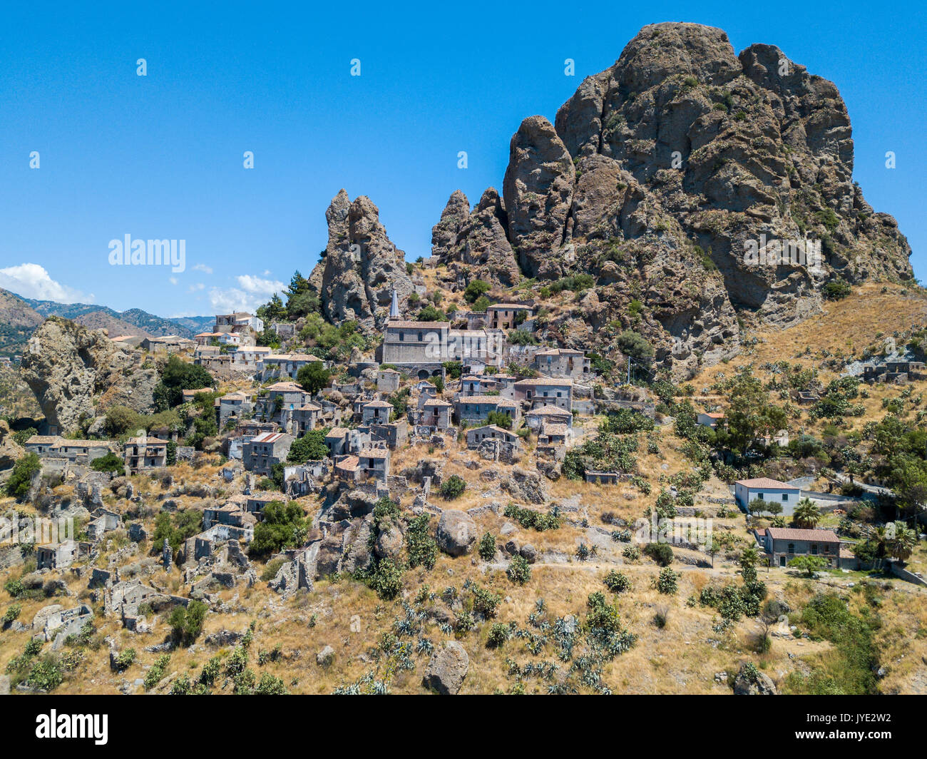 Aerial view of the Small village of Pentedattilo, church and ruins of ...