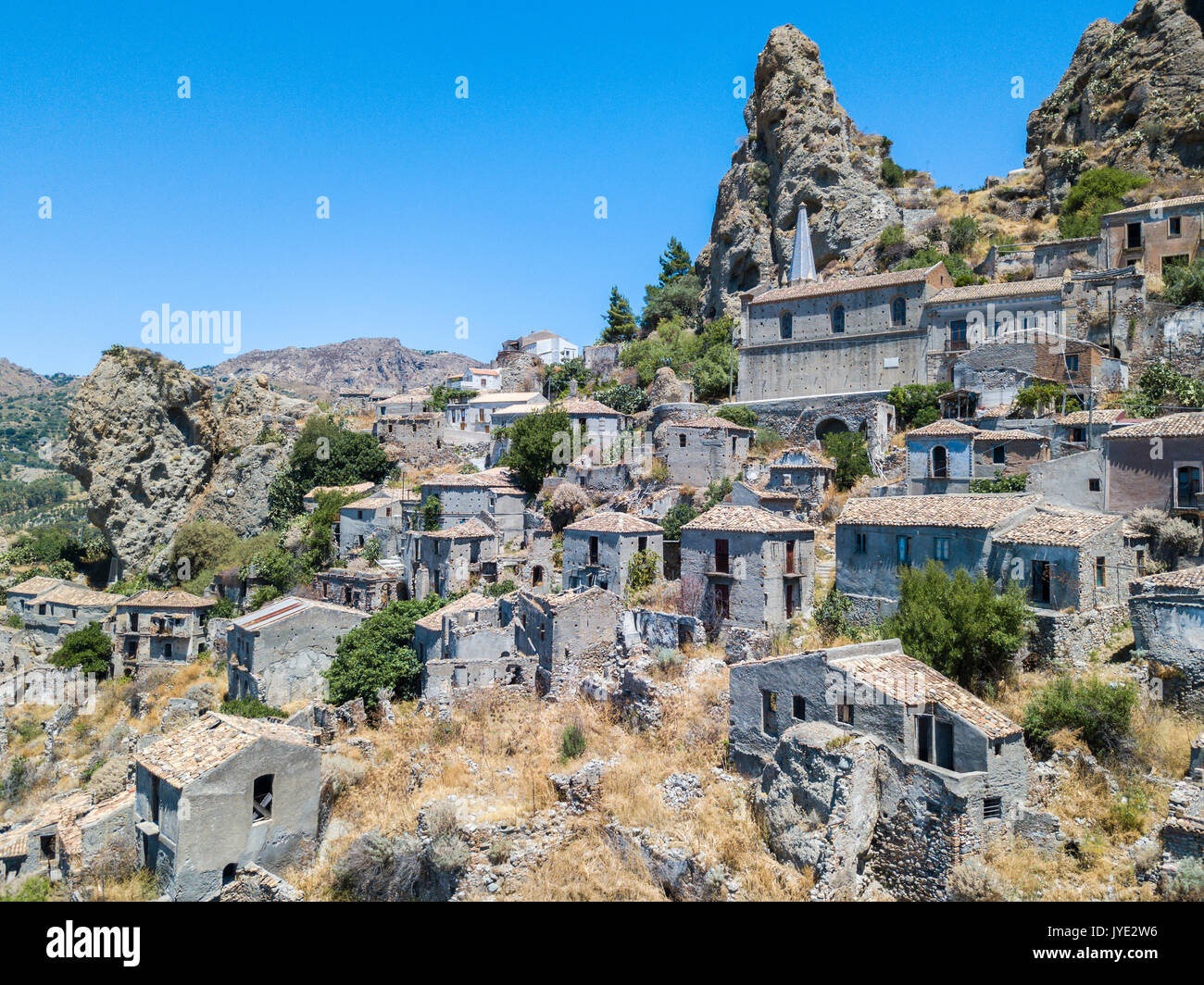 Aerial view of the Small village of Pentedattilo, church and ruins of ...