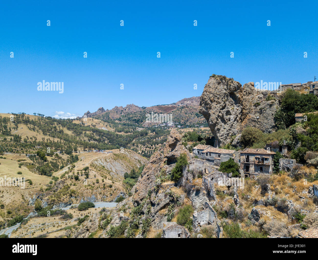 Aerial view of the Small village of Pentedattilo, church and ruins of ...