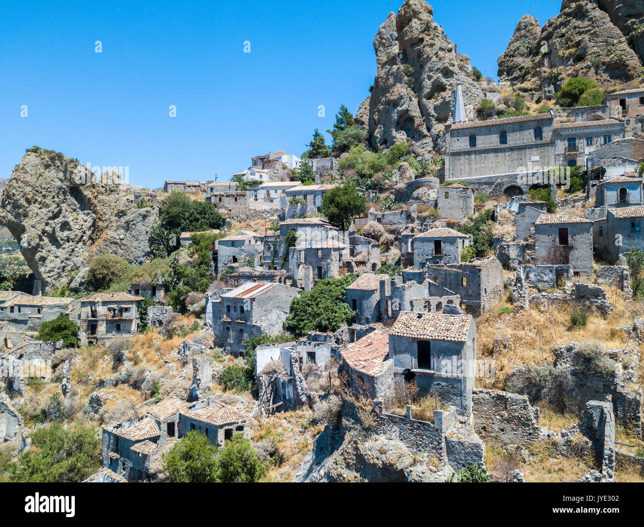 Aerial view of the Small village of Pentedattilo, church and ruins of ...