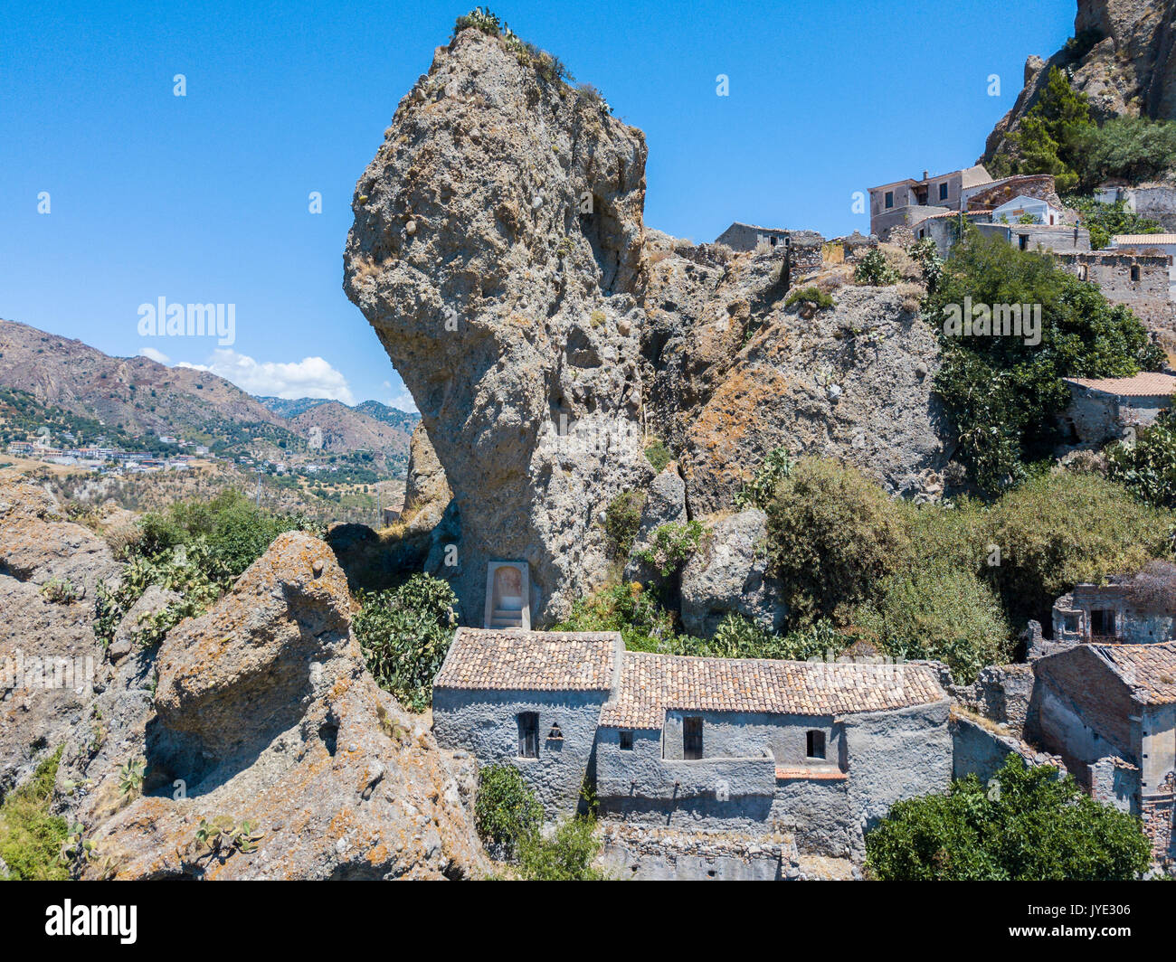 Aerial view of the Small village of Pentedattilo, church and ruins of ...