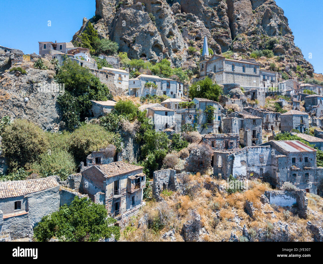 Aerial view of the Small village of Pentedattilo, church and ruins of ...