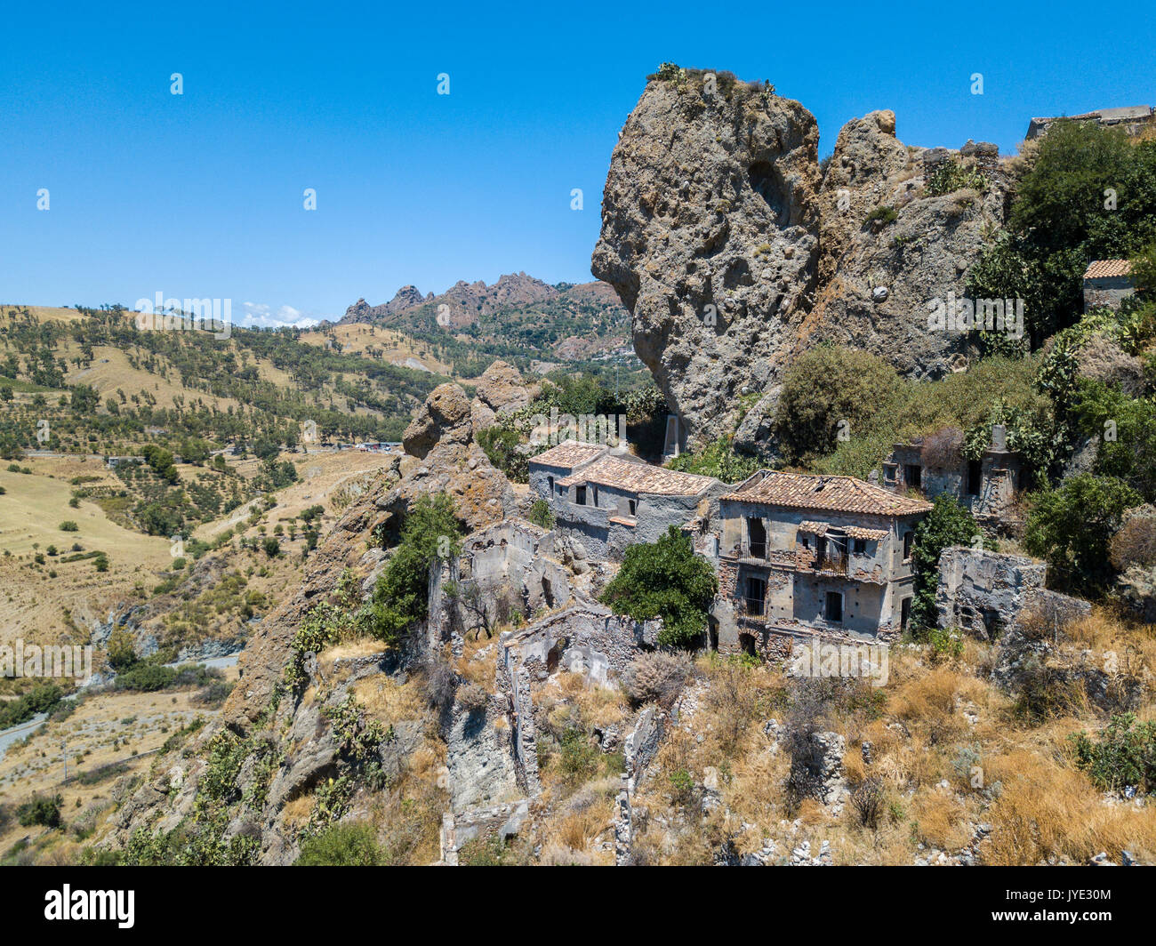 Aerial view of the Small village of Pentedattilo, church and ruins of ...