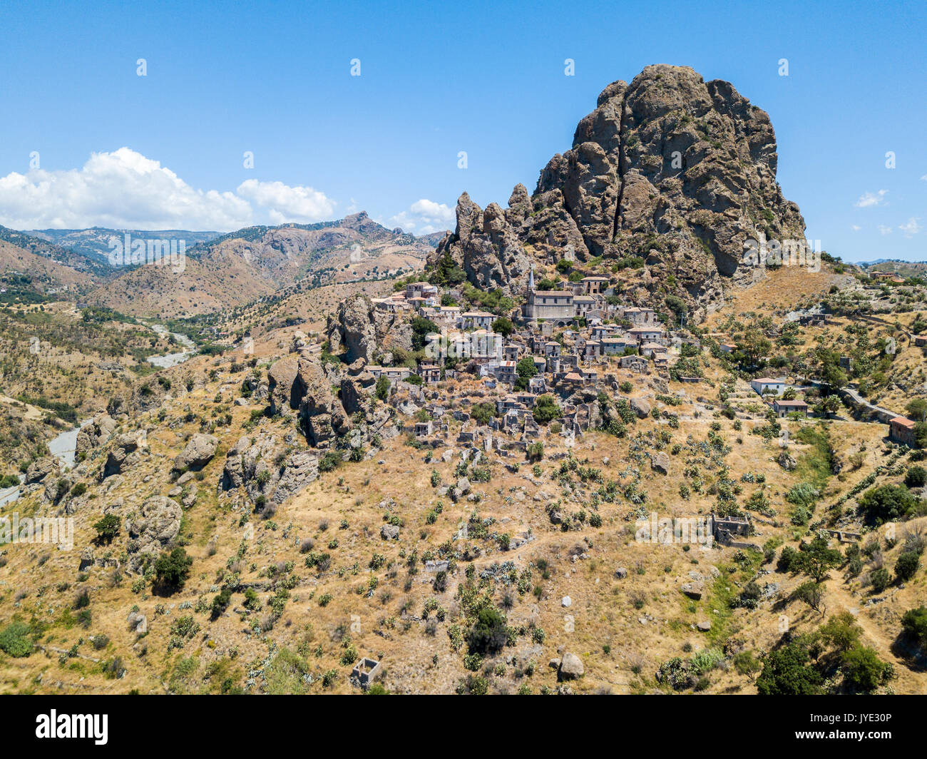 Aerial view of the Small village of Pentedattilo, church and ruins of ...
