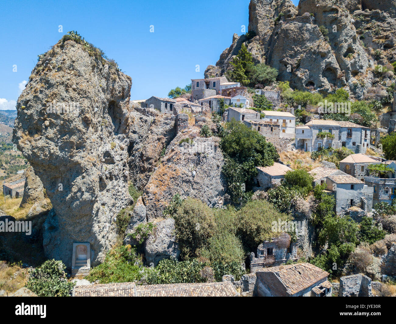 Aerial view of the Small village of Pentedattilo, church and ruins of ...