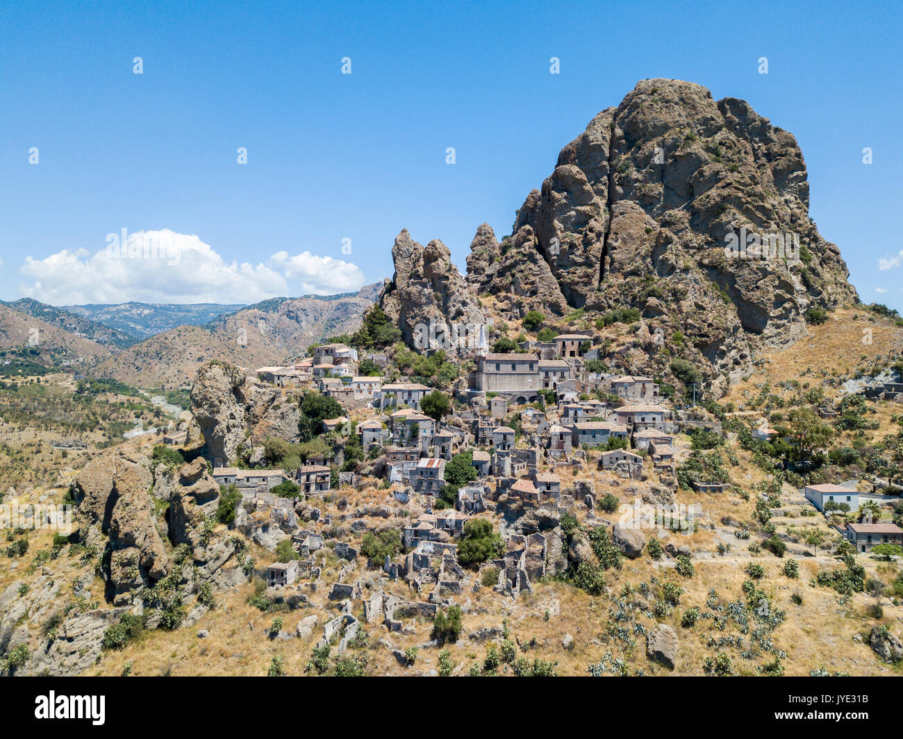 Aerial view of the Small village of Pentedattilo, church and ruins of ...