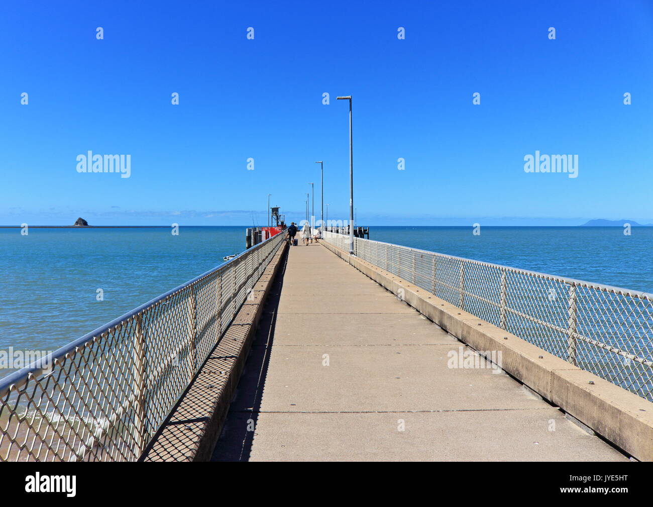 Palm Cove Jetty from the beach stretching out into the blue Coral Sea ...