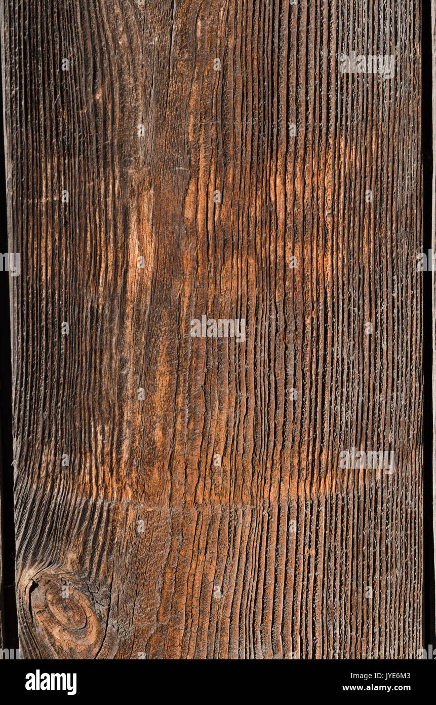 Texture, an outdated wooden board with fading brown spots. Vertical ...