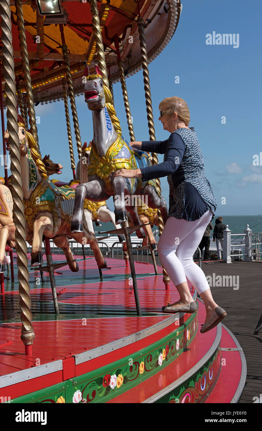 Riding On Carousel Horse Stock Photos & Riding On Carousel Horse Stock ...