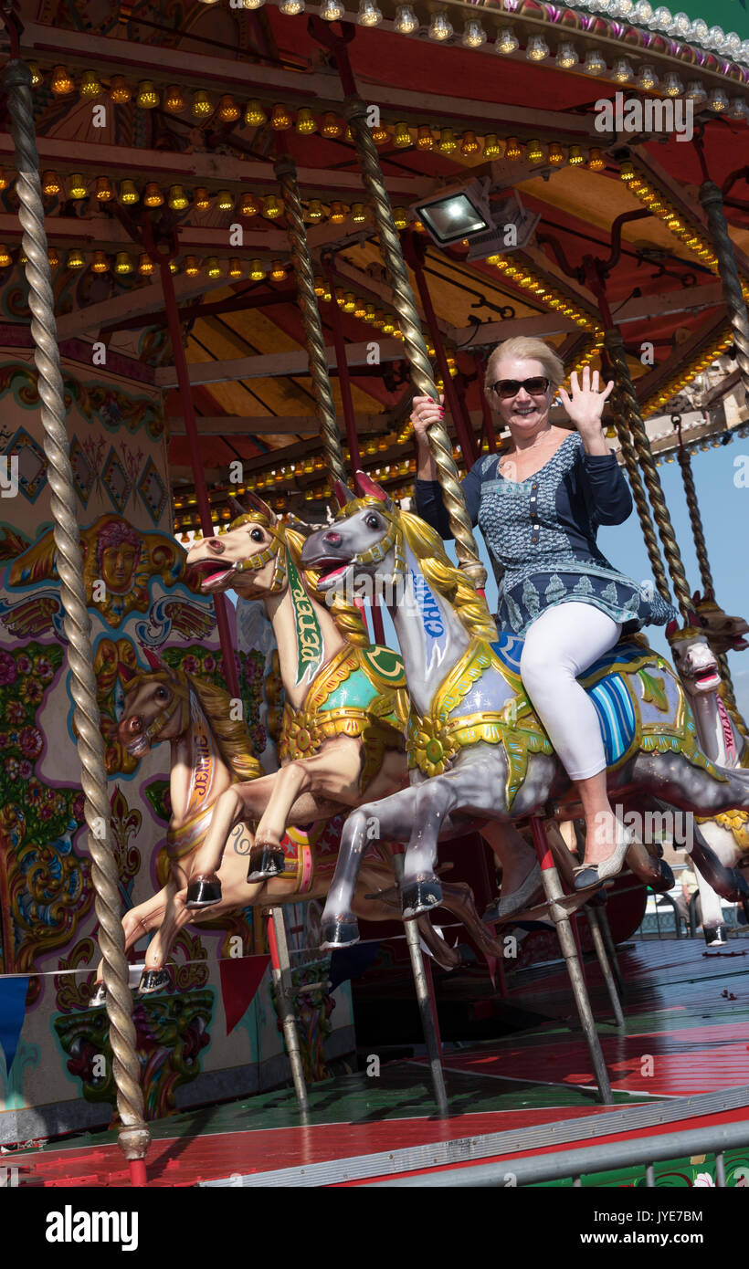 Riding On Carousel Horse High Resolution Stock Photography and Images ...