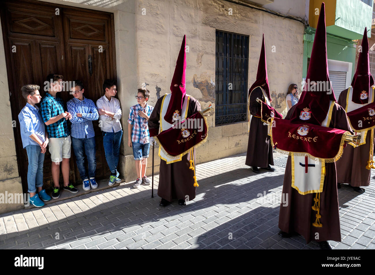 Set of boys watching Holy week procession, Spain, take in Linares, Jaen ...