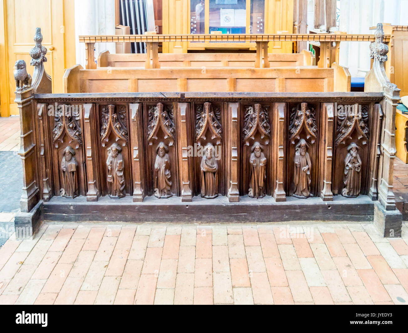 Mediaeval choir stalls with carved figures of saints and apostles ...
